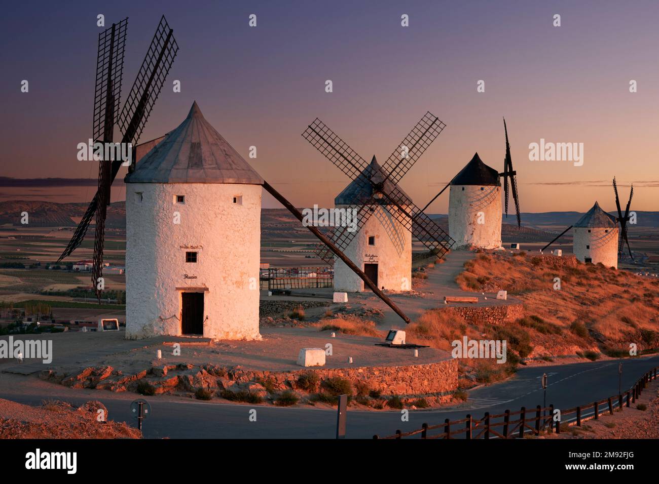 Sunrise Consuegra windmills as the sunning is coming up the landscape ...
