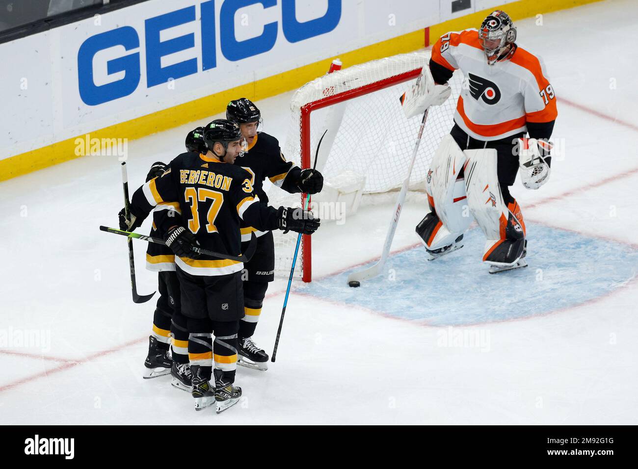 Boston Bruins players including Patrice Bergeron (37) and Craig Smith ...