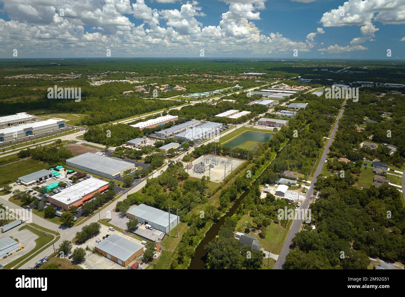 Aerial view of industrial park with goods warehouses and logistics centers in city zone from ...