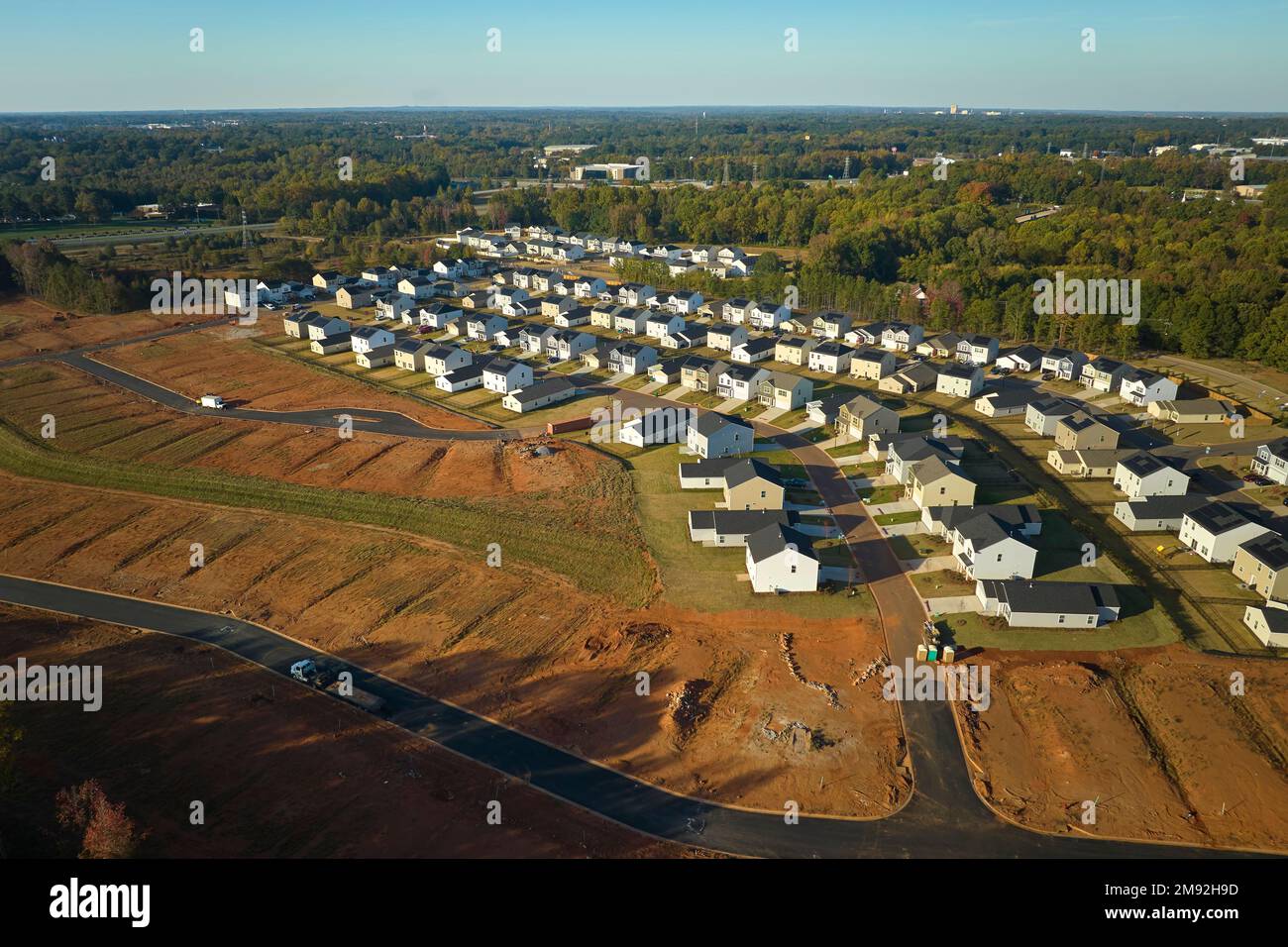 Aerial view of real estate development with tightly located family ...