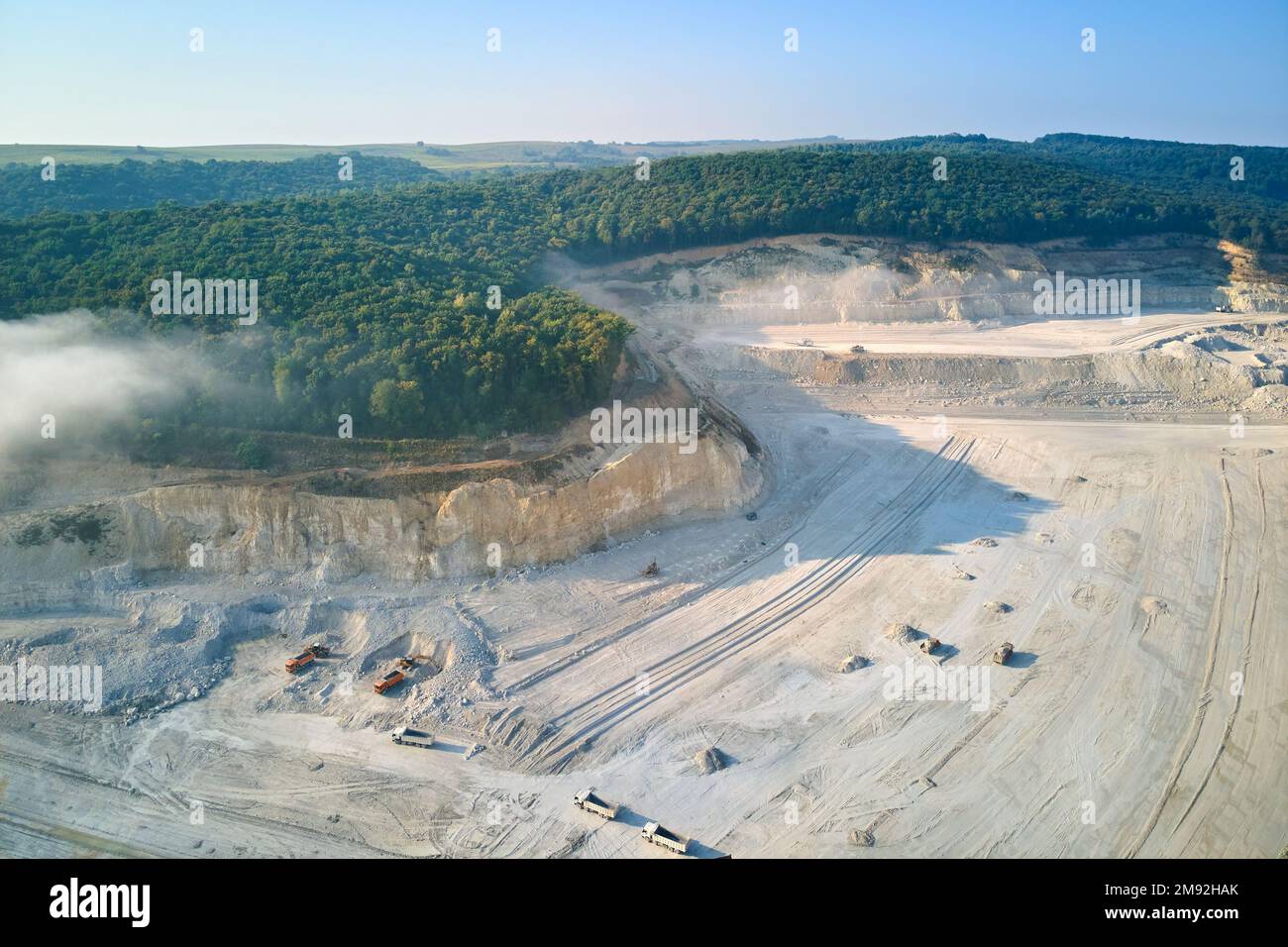 Aerial view of open pit mining site of limestone materials extraction ...