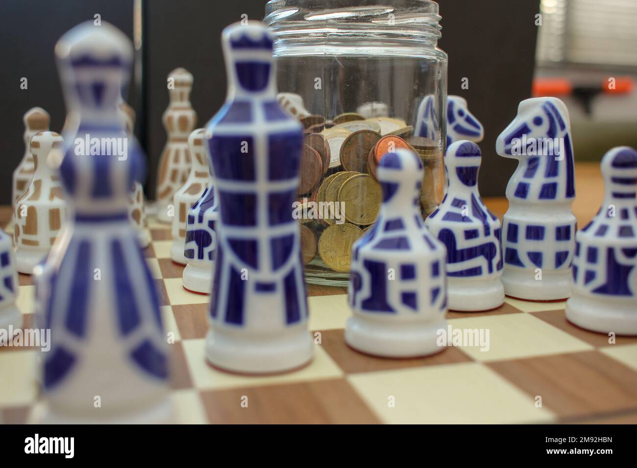 euro coins on the chessboard and among the chess pieces Stock Photo - Alamy