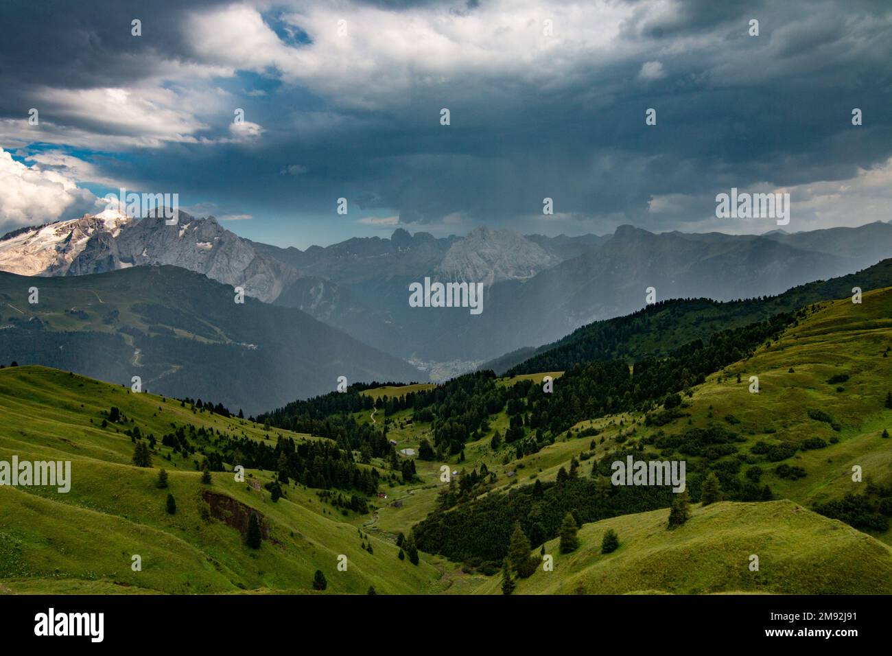 Beautiful alpine landscape with mountains and green meadows and a ...