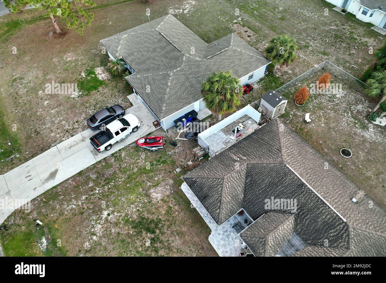 Aerial view of typical contemporary american private house with roof ...