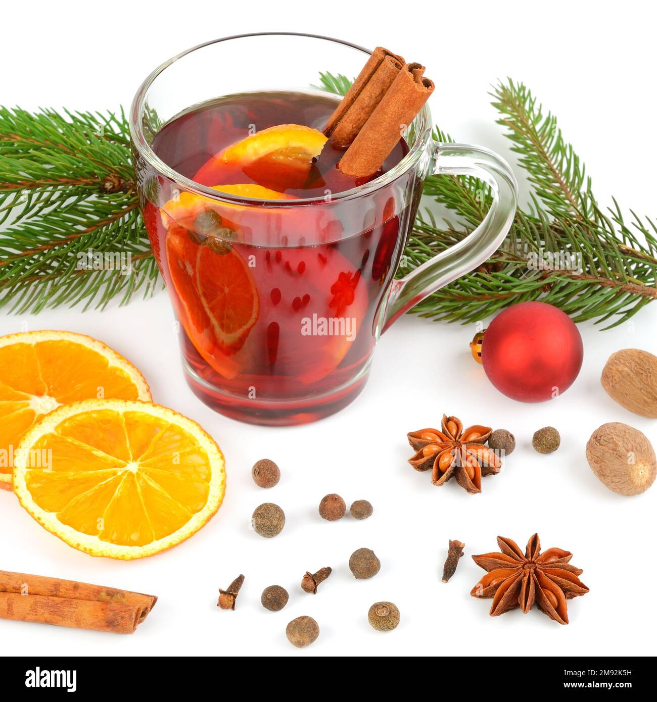 Hot red mulled wine isolated on white background with spices, orange ...