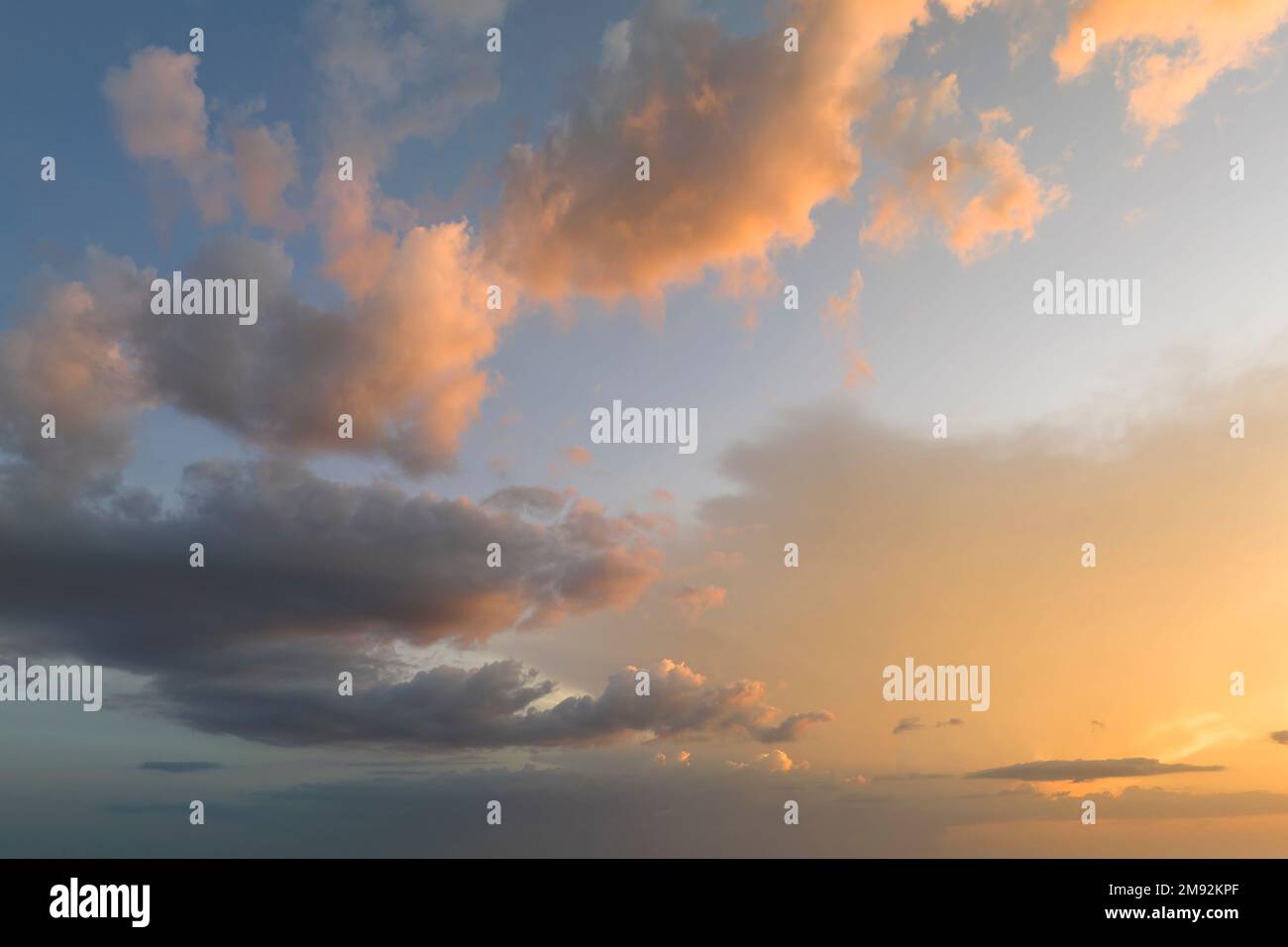 Colorful evening landscape with soft pastel coloured clouds on ...