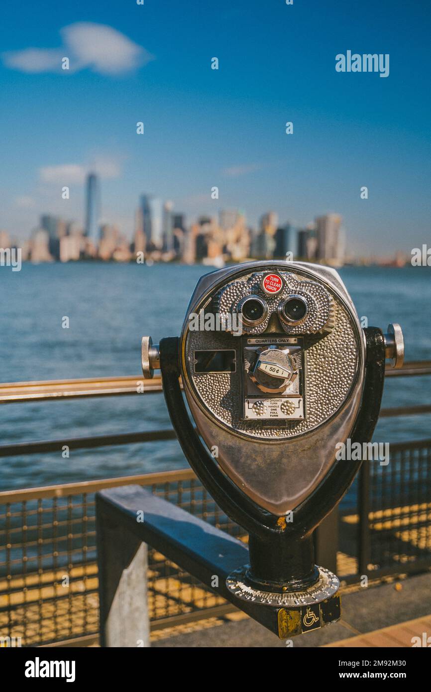 Modern binoculars located on observation platform near waving sea ...