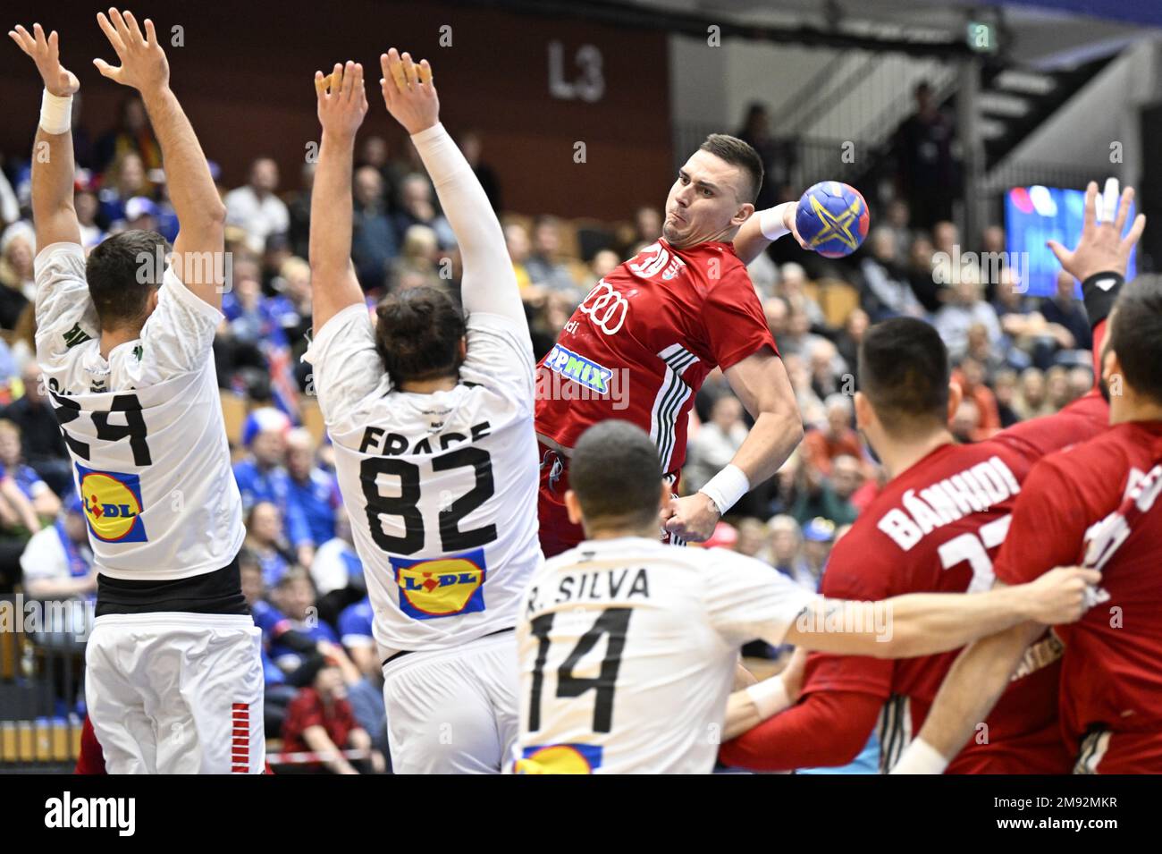 KRISTIANSTAD, SWEDEN 20230116Hungary's Richárd Bodó (top) shoots during ...