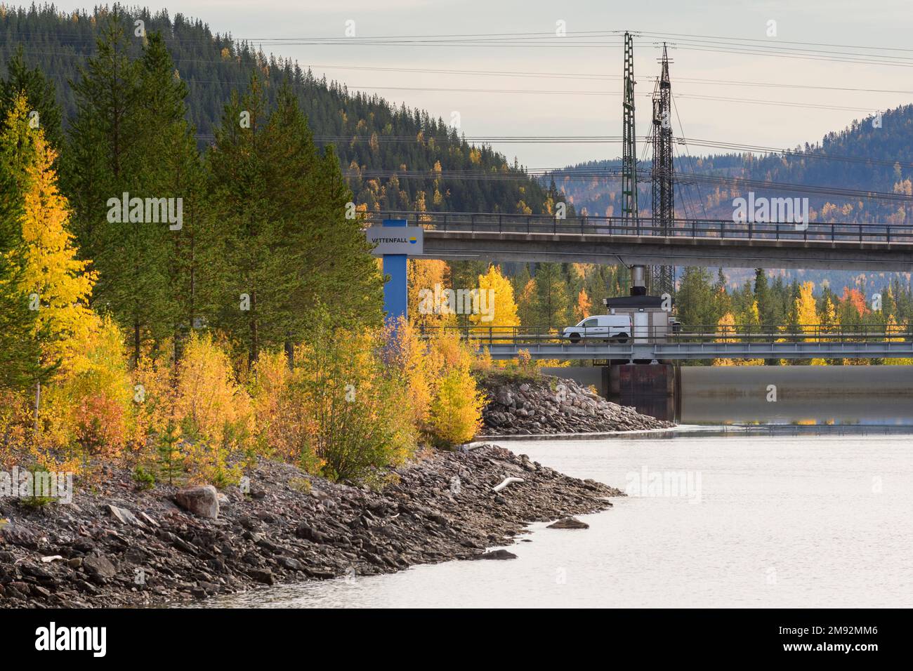 Reservoir with hydro power dam and electricity pylons in Stora ...