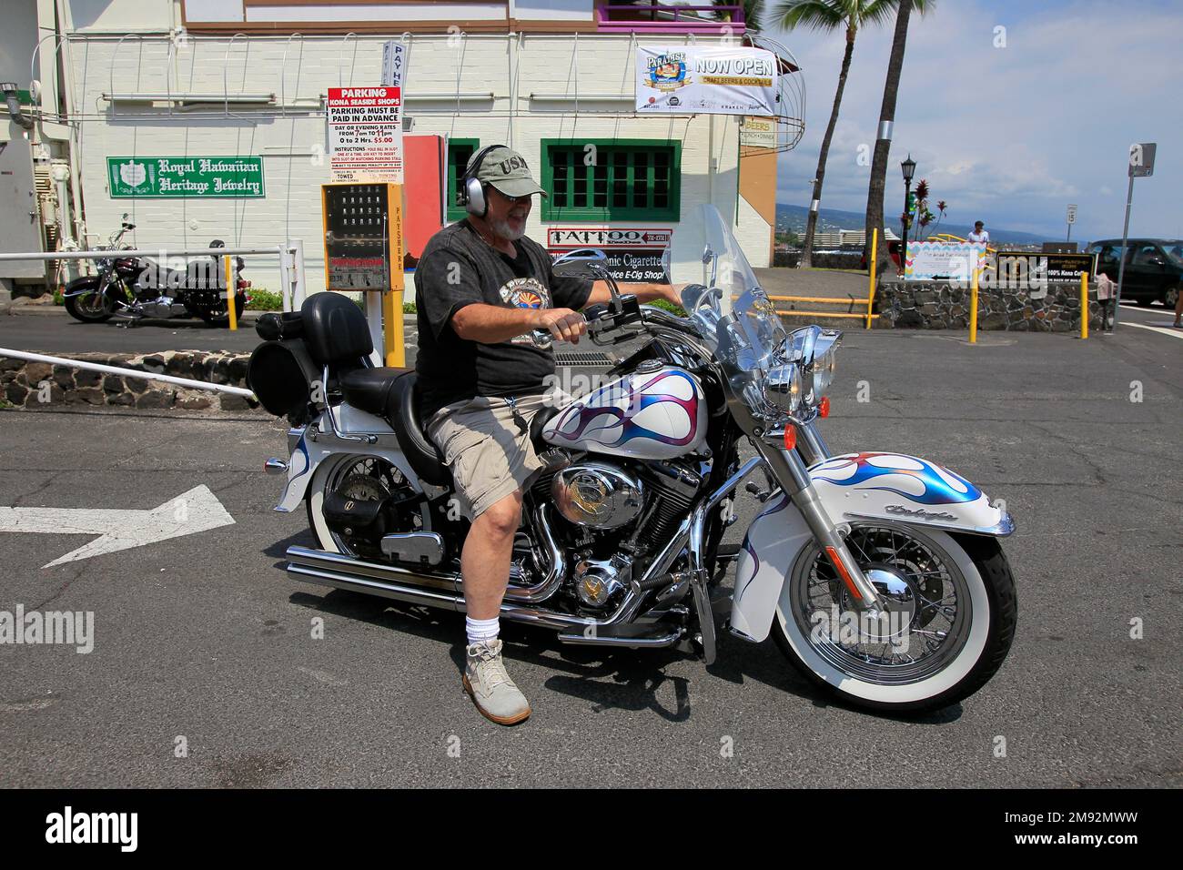 BIG ISLAND-HAWAII-22-06-2104. An old man drives a Harley Davidson ...