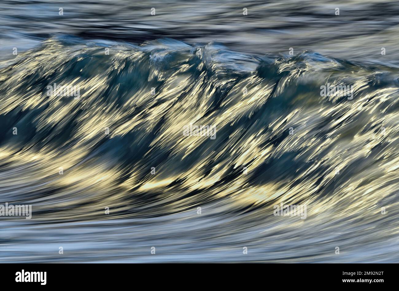 Abstract background of fast stream of water splashing in blue sea with ...