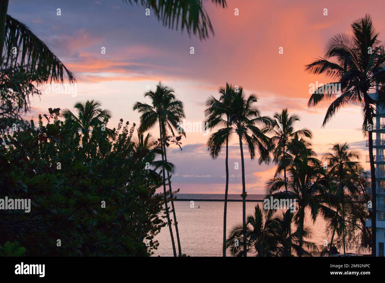 HILO-BIG ISLAND-HAWAII-21-06-2104. A sunrise is seen in the bay of Hilo ...