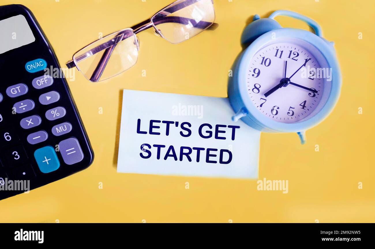 LET'S GET STARTED text concept writing on sticker with office tools on ...