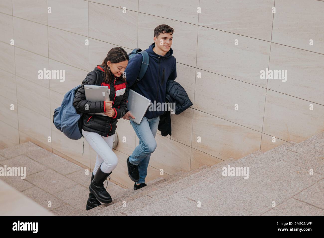 Students climbing stairs staircase hi-res stock photography and images ...