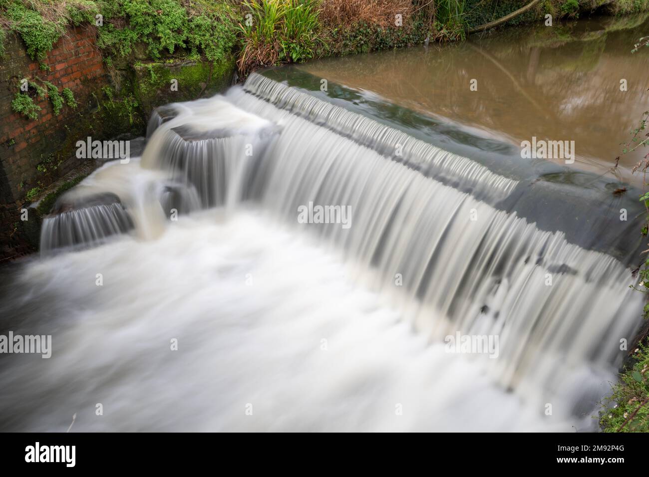 Long exposure of a watefall on the River Lim walkway at Lyme Regis in ...