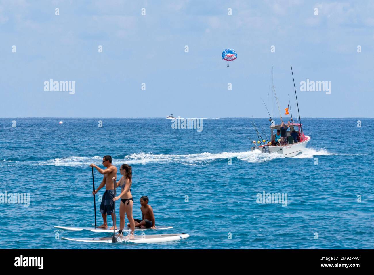 BIG ISLAND-HAWAII-22-06-2104. Tourists surf waters of the pacific in ...