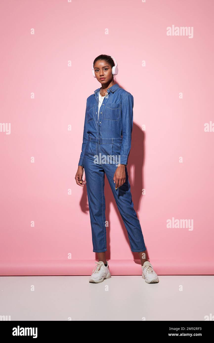 Full body of young stylish African American female model in denim suit ...