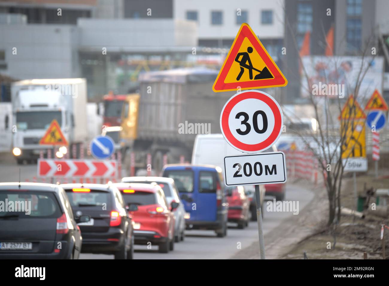 Roadworks warning traffic signs of construction work on city street and ...