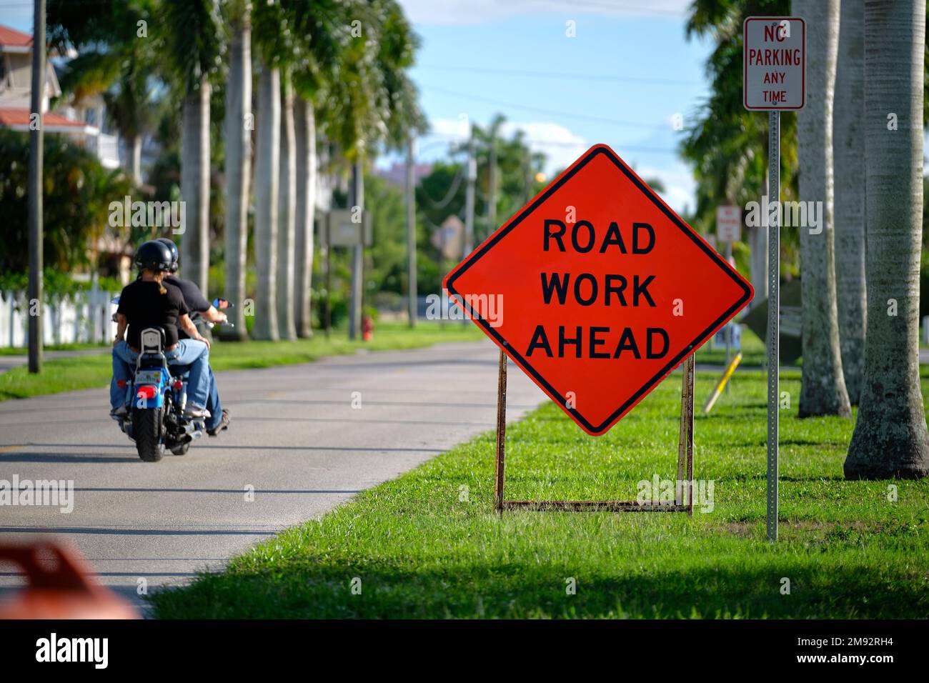 Road work ahead sign on street site as warning to cars about ...