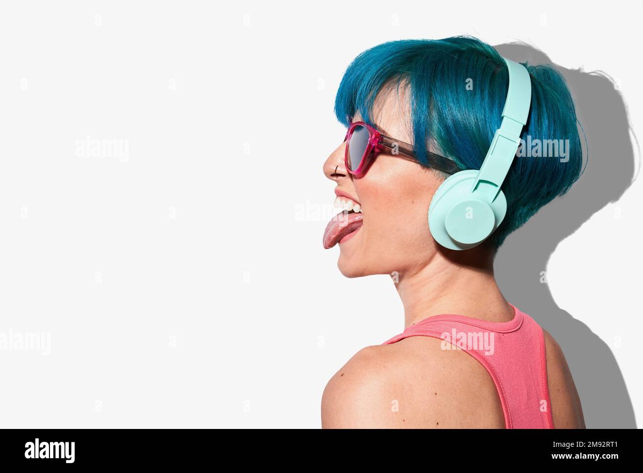 Woman sticking out tongue side hi-res stock photography and images - Alamy