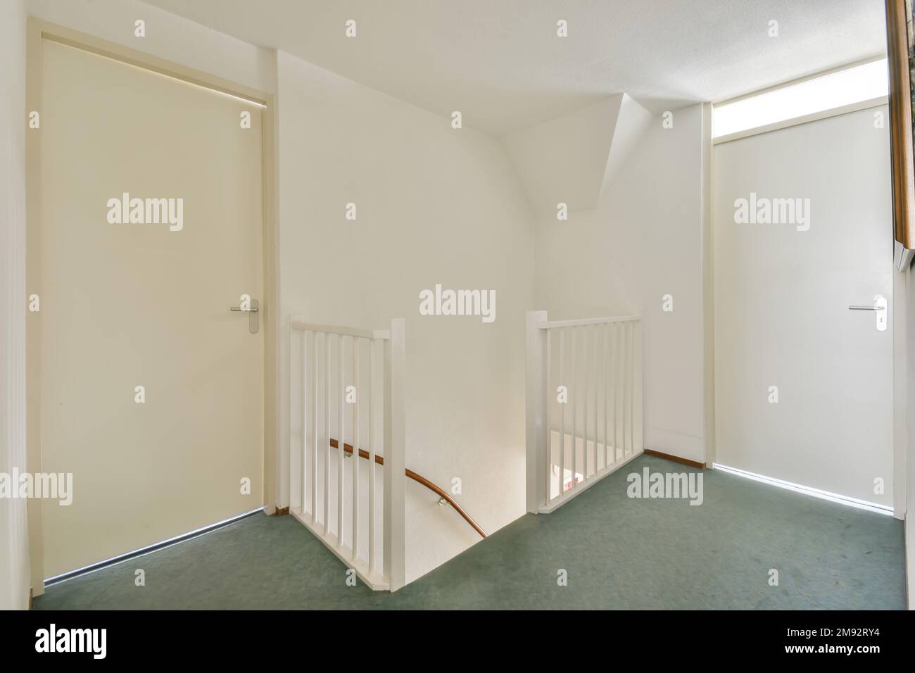 Interior of a house with stairs to an down floor in a bright ...