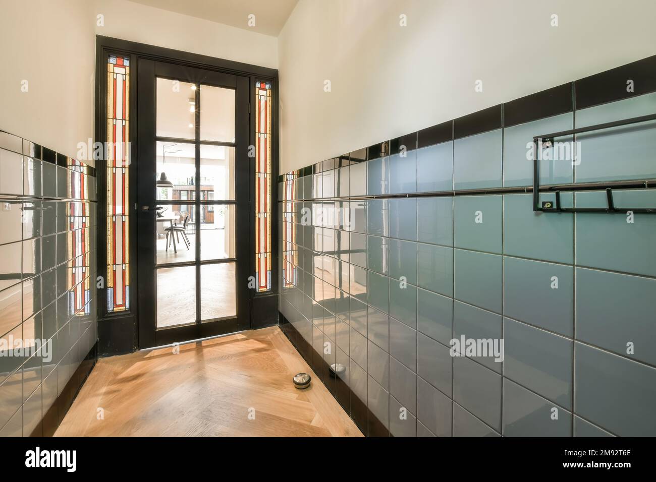 Interior passage way with tile wall in modern house Stock Photo - Alamy