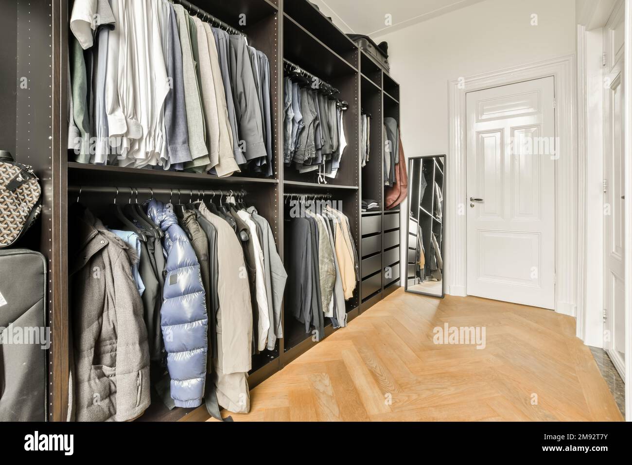 Interior of a dressing room of a modern house with clean and folded ...