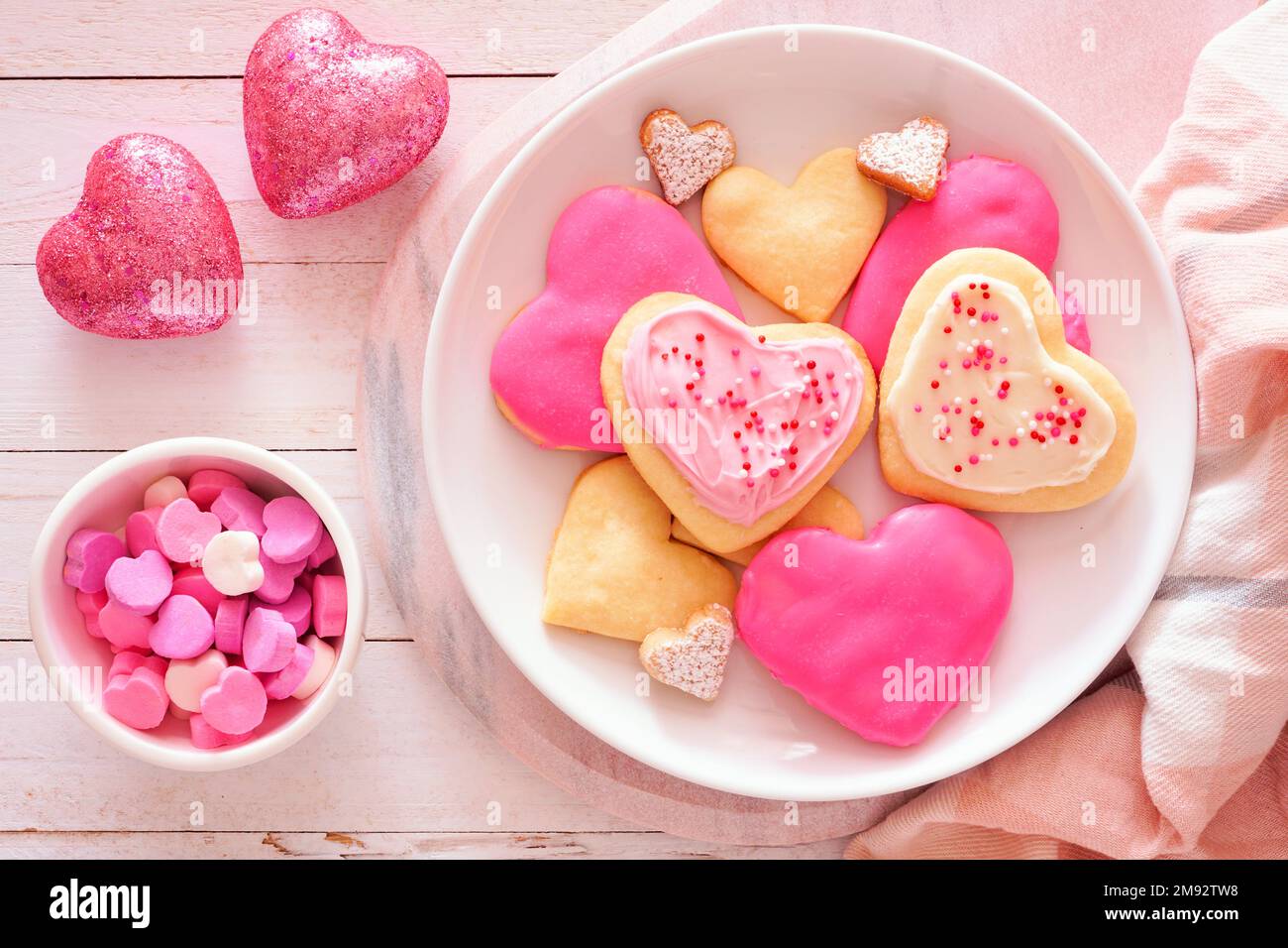 Heart shaped Valentines Day cookies with pink and white icing and ...