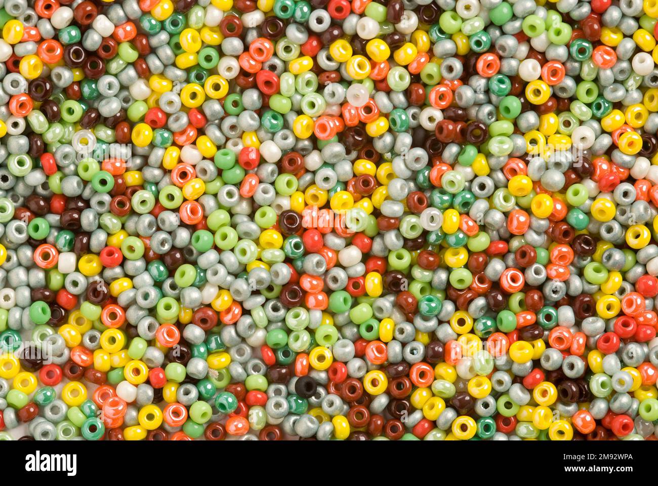 Different color glass beads background Stock Photo - Alamy