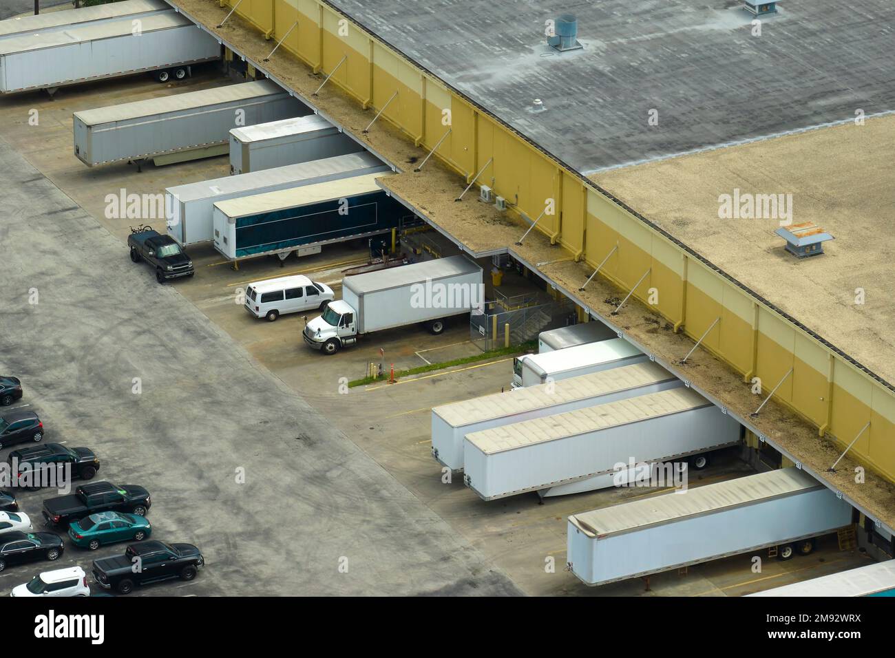 Top view of giant logistics center with many commercial trailer trucks ...