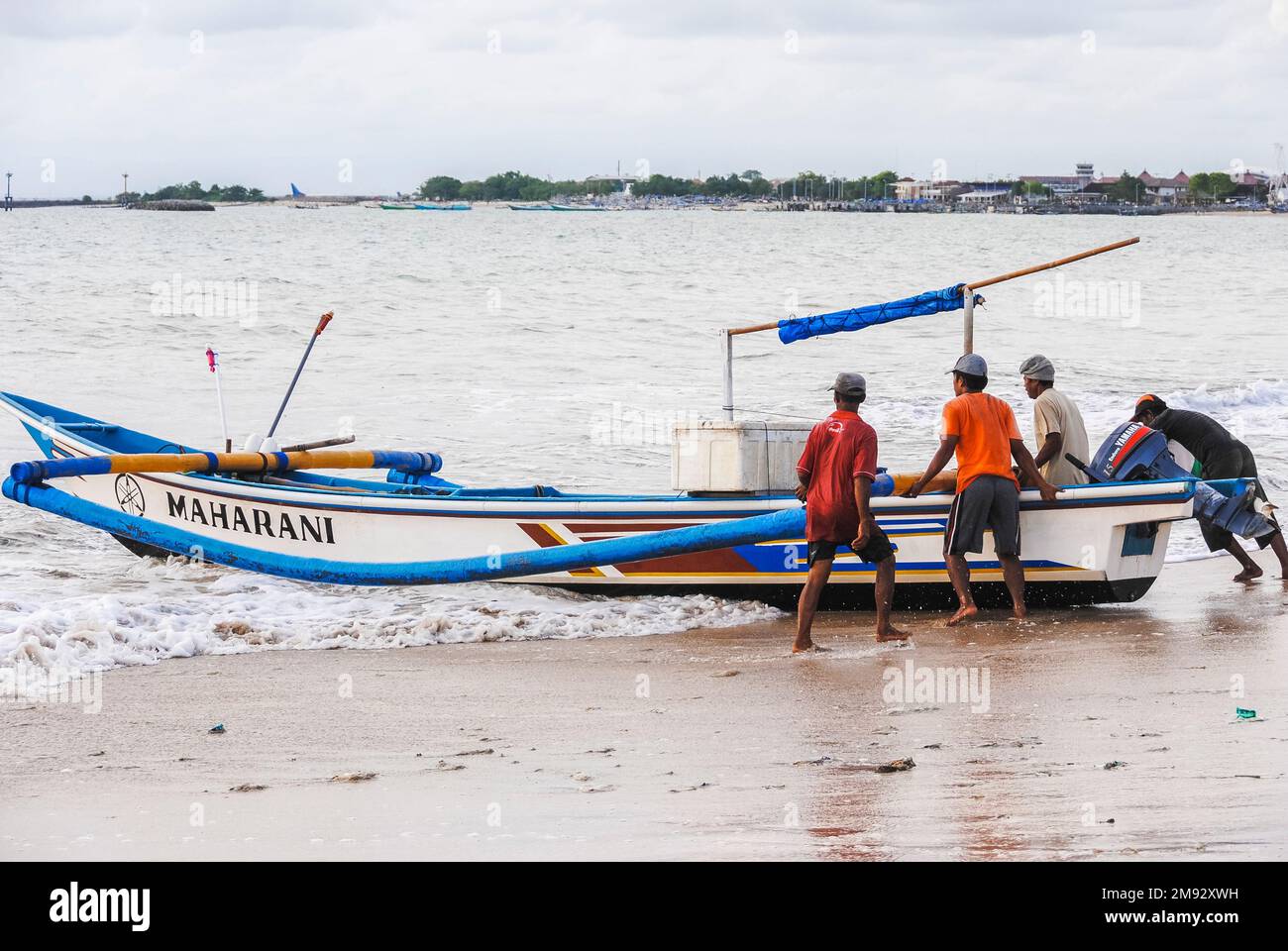 Bali, Indonesia - circa February 2017: Fishermen getting their jukung ...