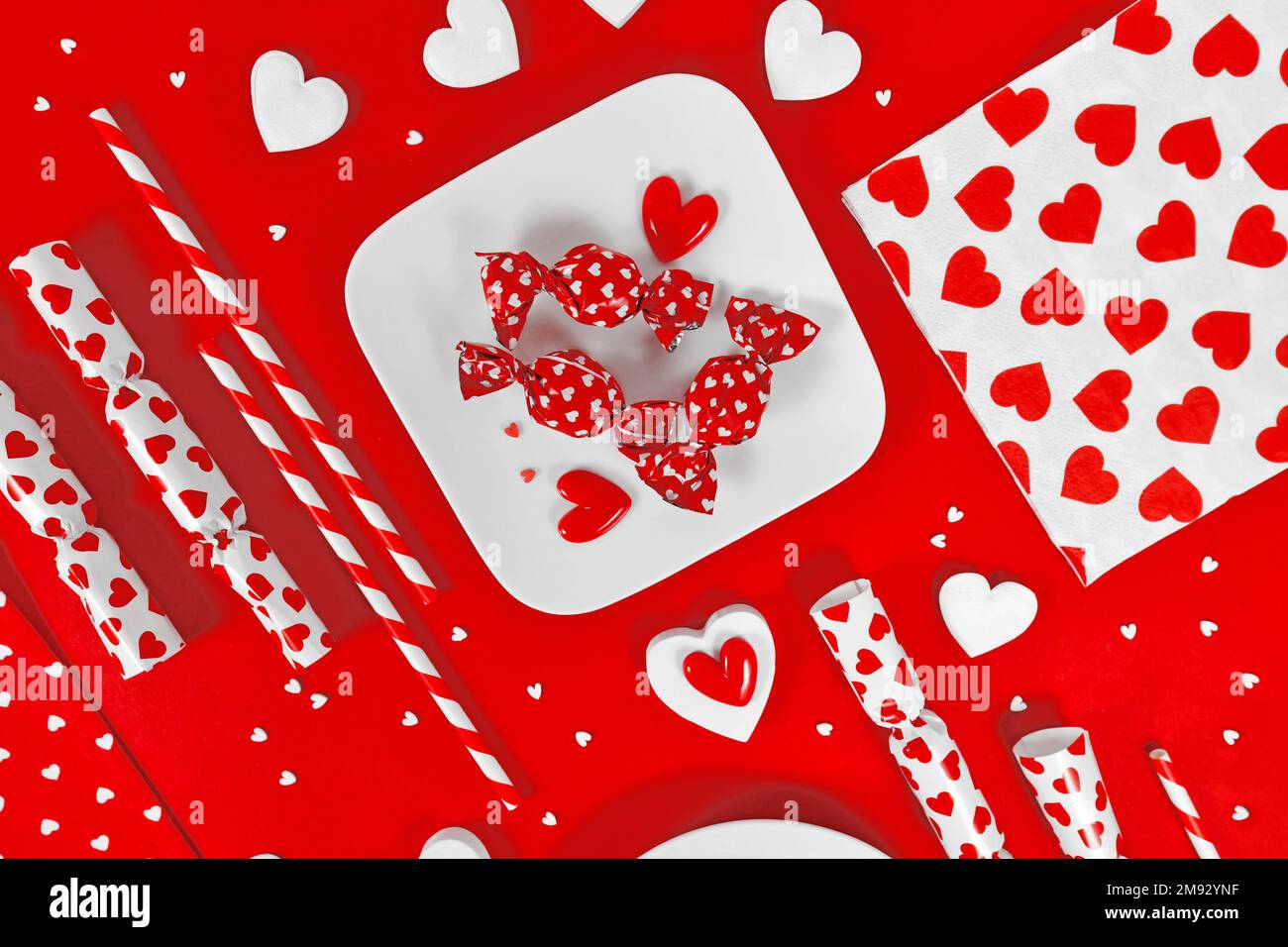 Red Valentine's Day decoration with candy, heart ornaments and sugar ...