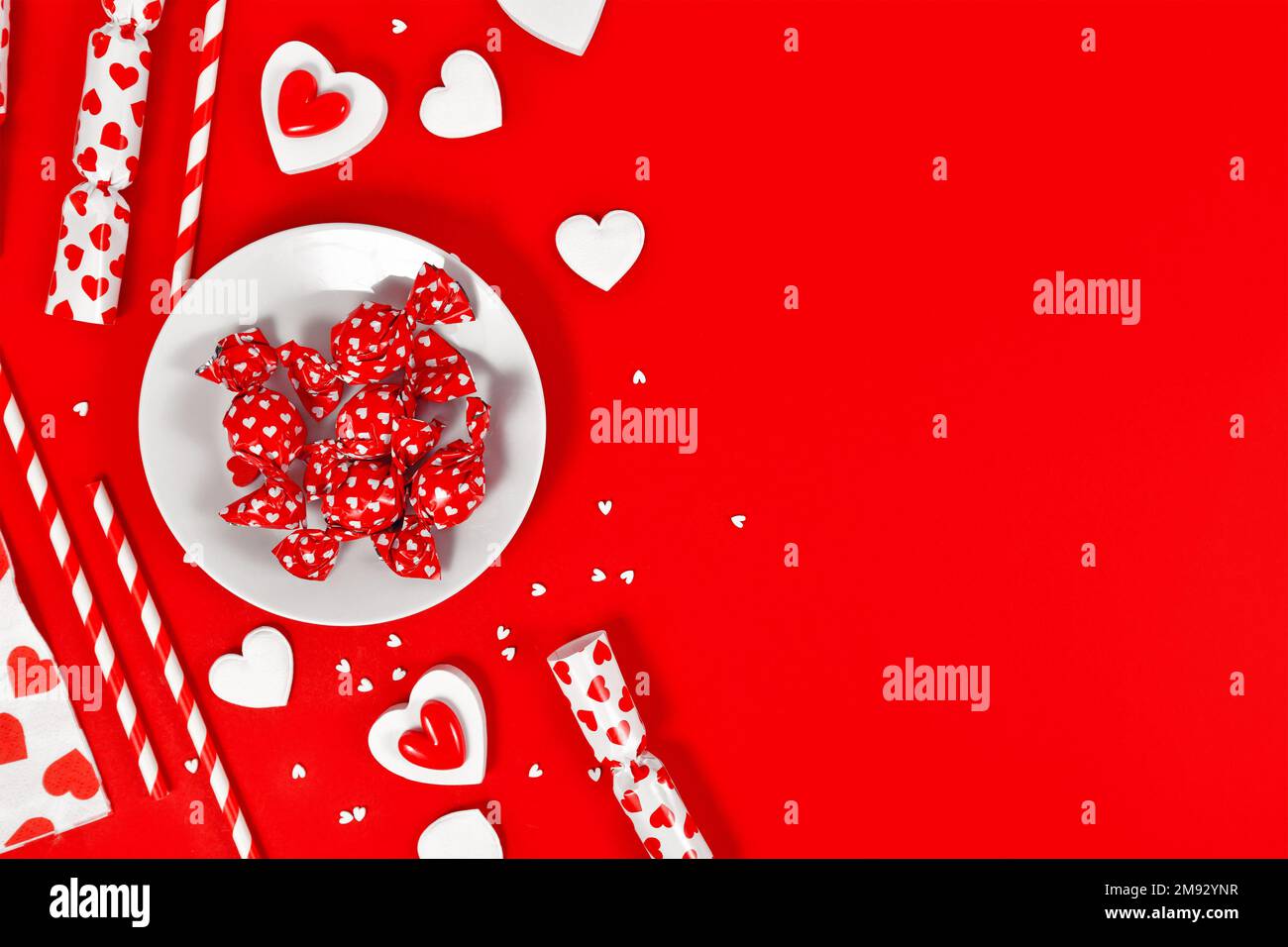 Red Valentine's Day decoration with candy, heart ornaments and sugar ...