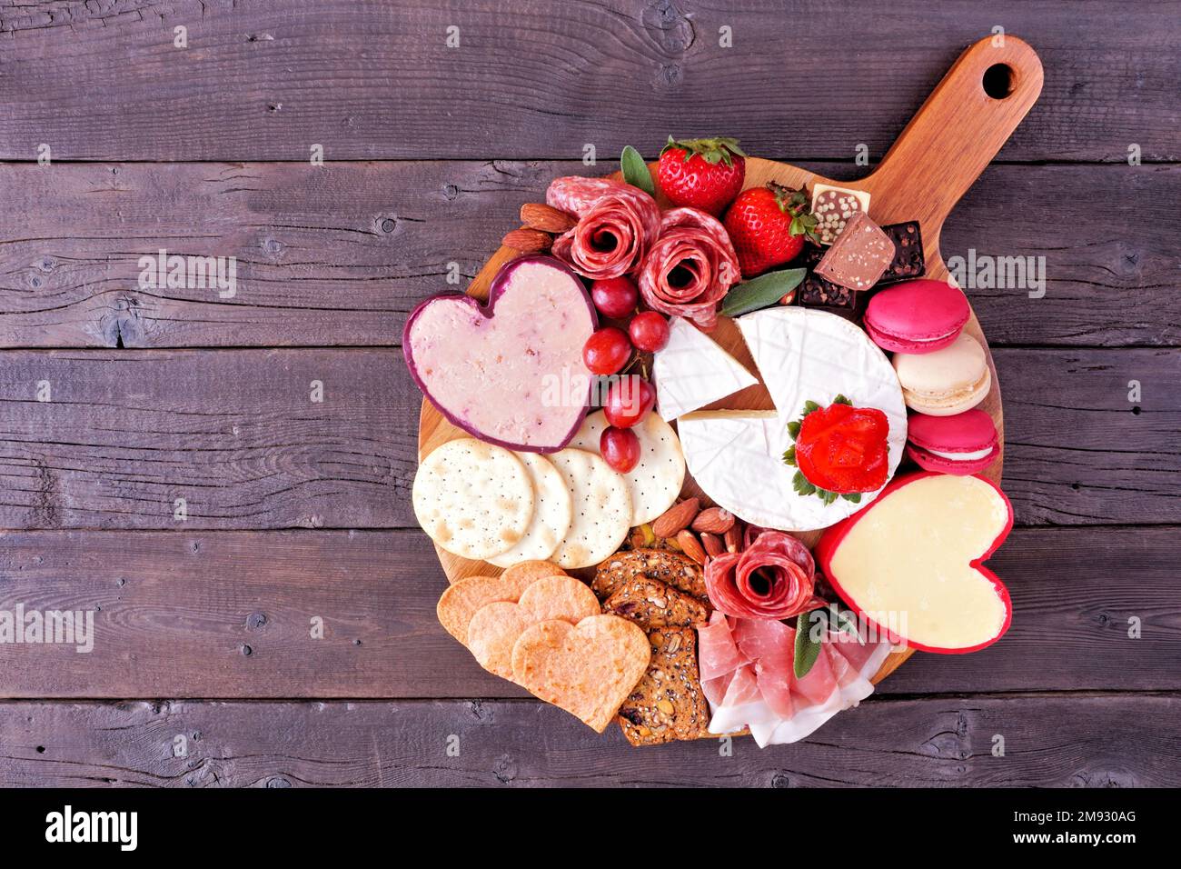 Valentine's Day theme charcuterie board with a selection of cheeses ...