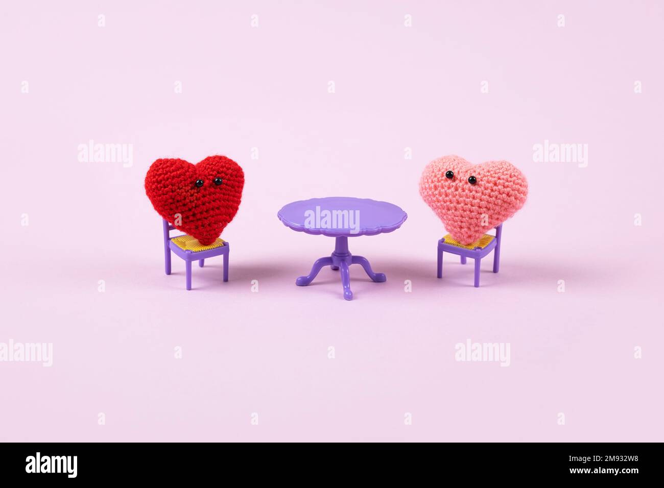Concept of Valentine's Day. A composition of two knitted red and pink ...