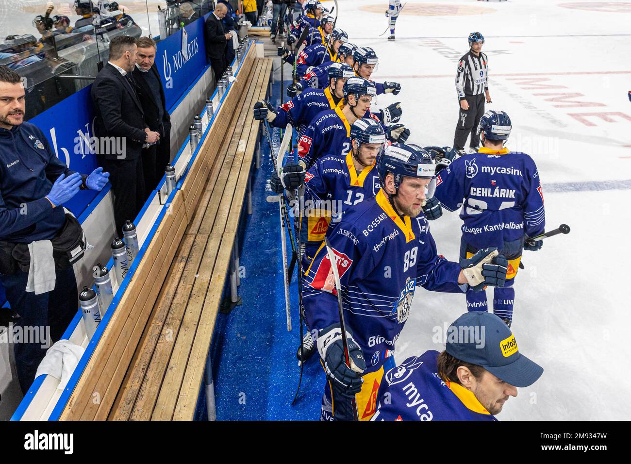 Goal scorer Peter Cehlarik #34 (EV Zug) high fives with his player ...