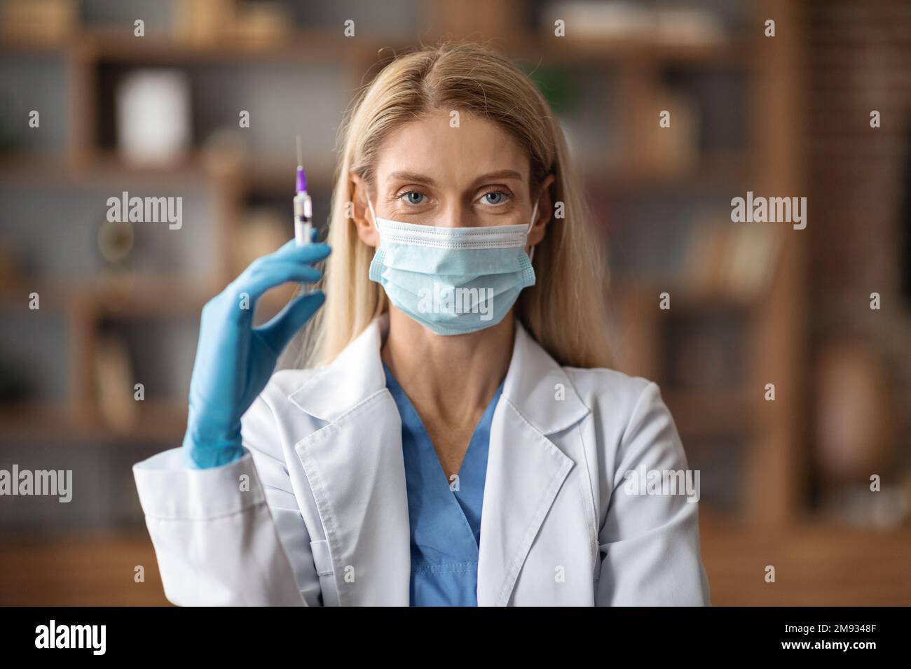 Immunization Concept. Doctor Lady In Medical Mask Holding Syringe With Vaccine Dose Stock Photo ...