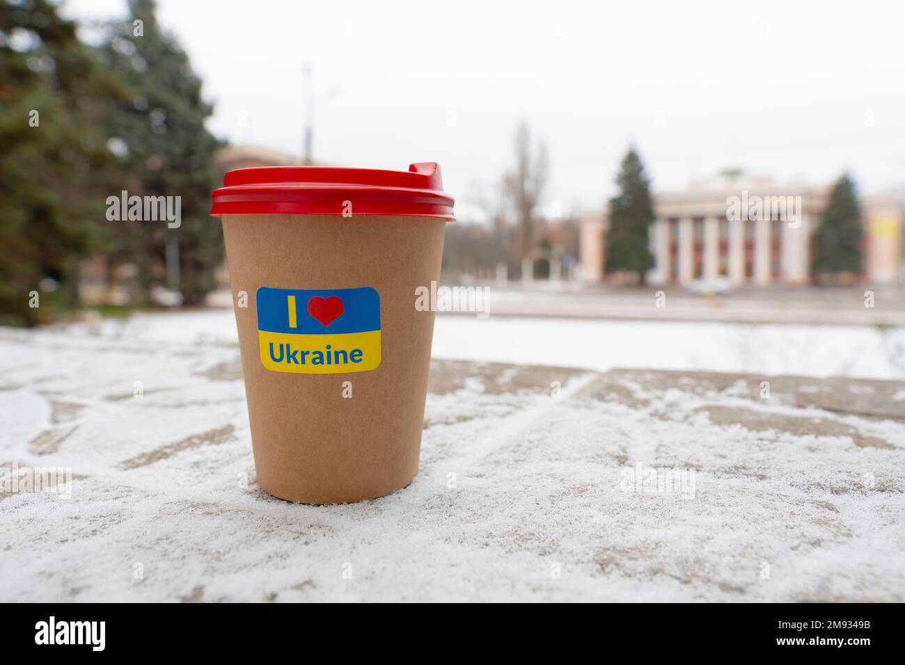 Winter. Cold weather. Cup of coffee with a patriotic sticker "I love ...