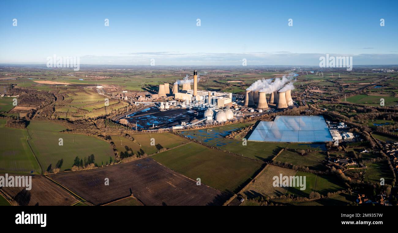 Aerial view of Drax Power Station near Selby in North Yorkshire with the greenhouses that use ...