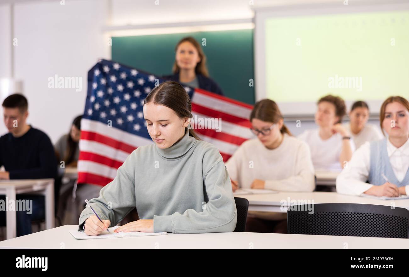 Young girl student diligently studies at school Stock Photo - Alamy