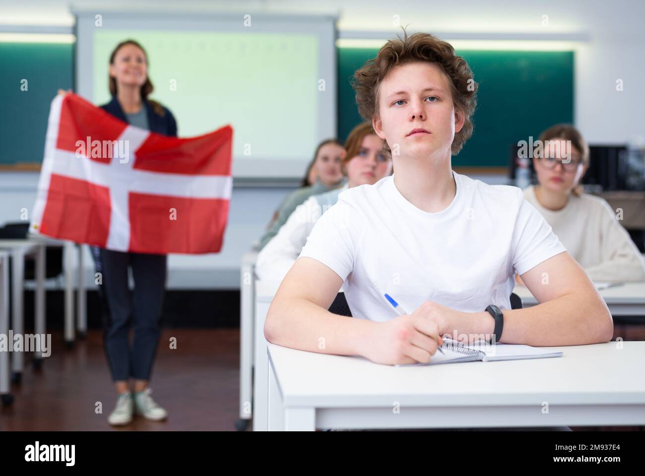 Young boy student studying diligently at school Stock Photo - Alamy