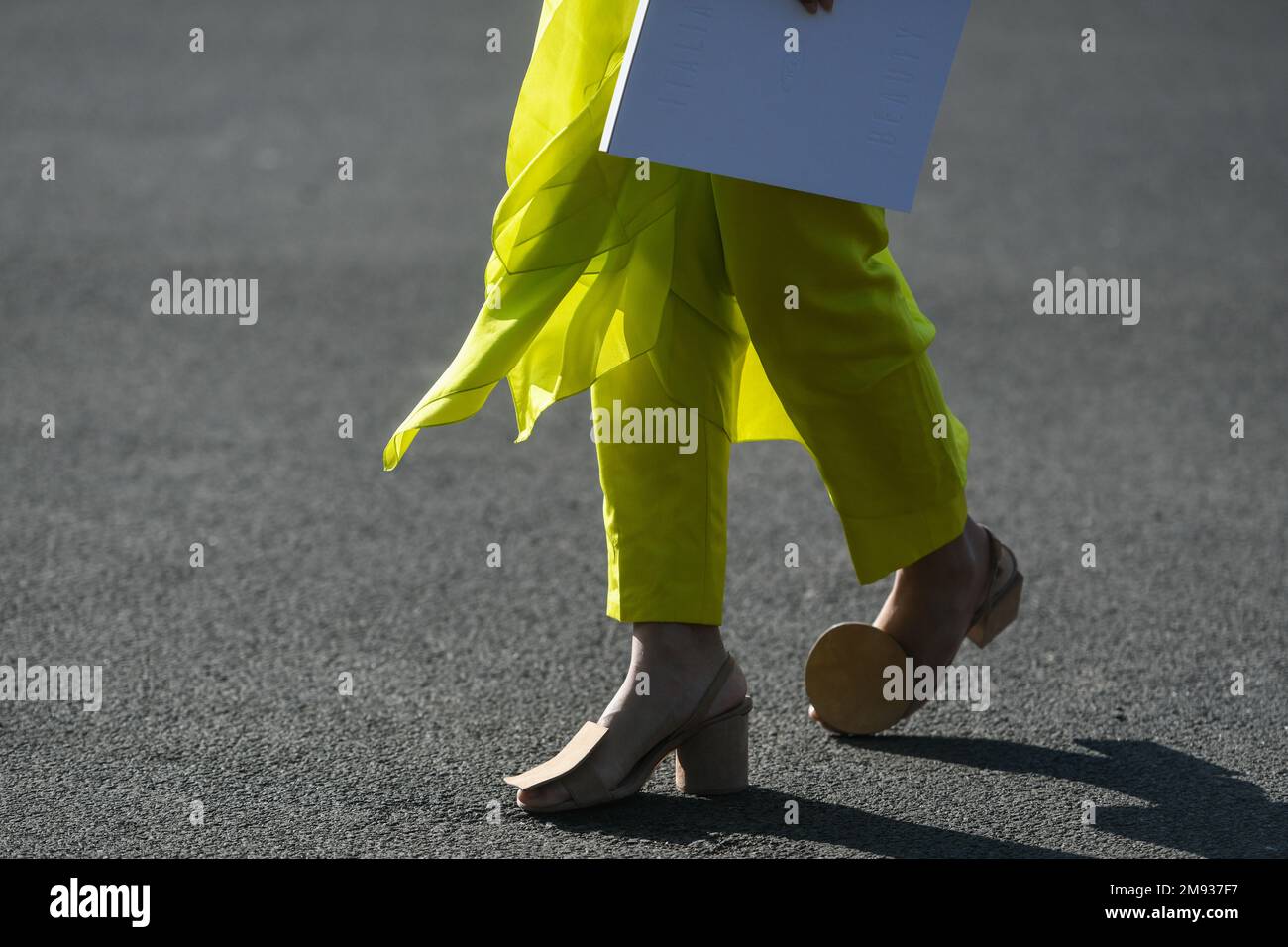 Milan, Italy - February 26, 2022: Female in stylish bright yellow ...