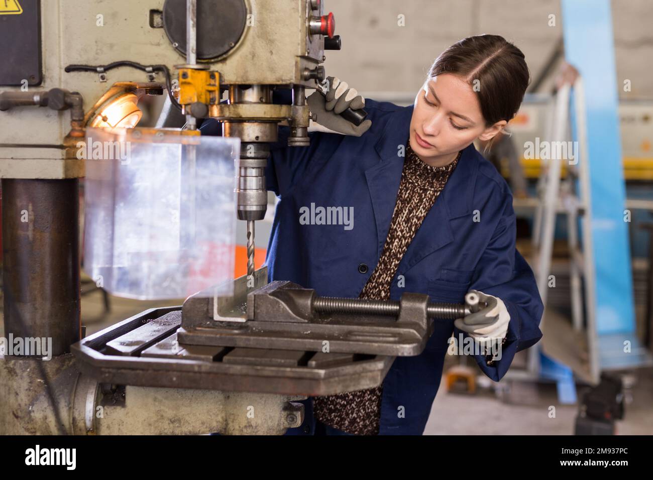 Workshop worker drilling metal plate hi-res stock photography and ...