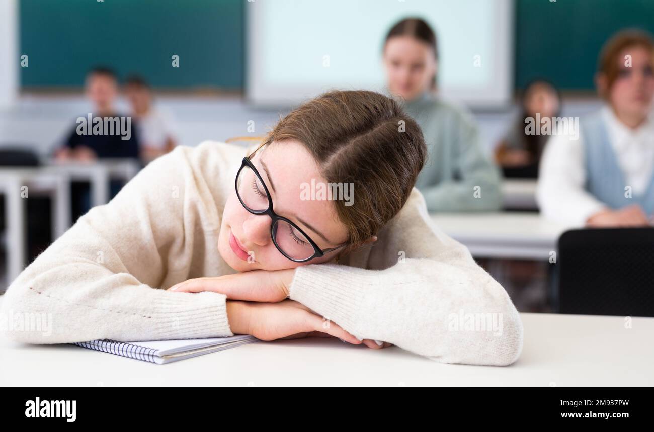 Young girl student diligently studies at school Stock Photo - Alamy