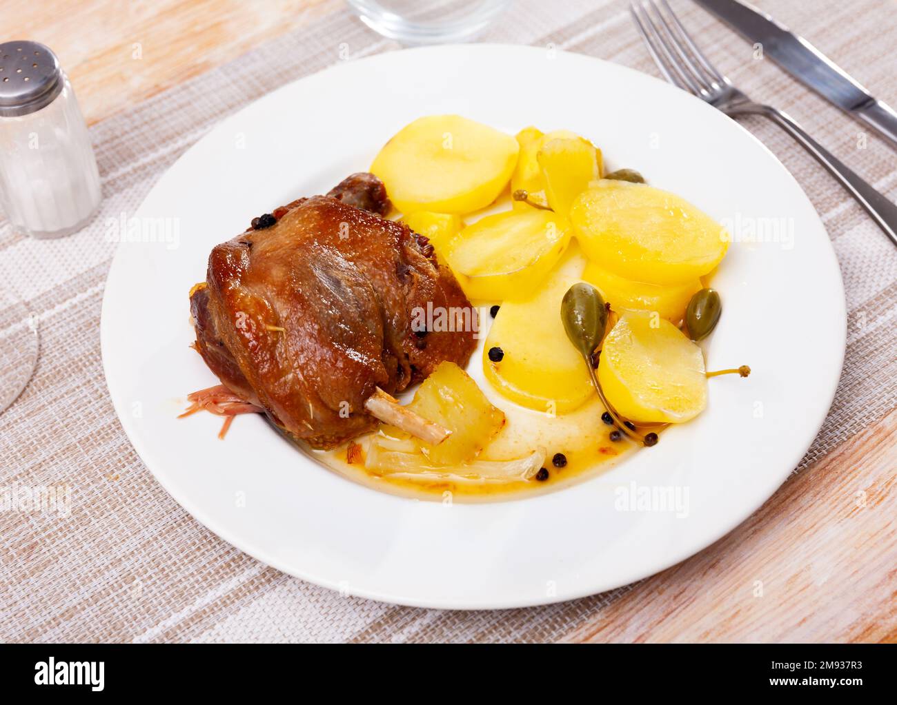Portion of duck confit on table Stock Photo - Alamy