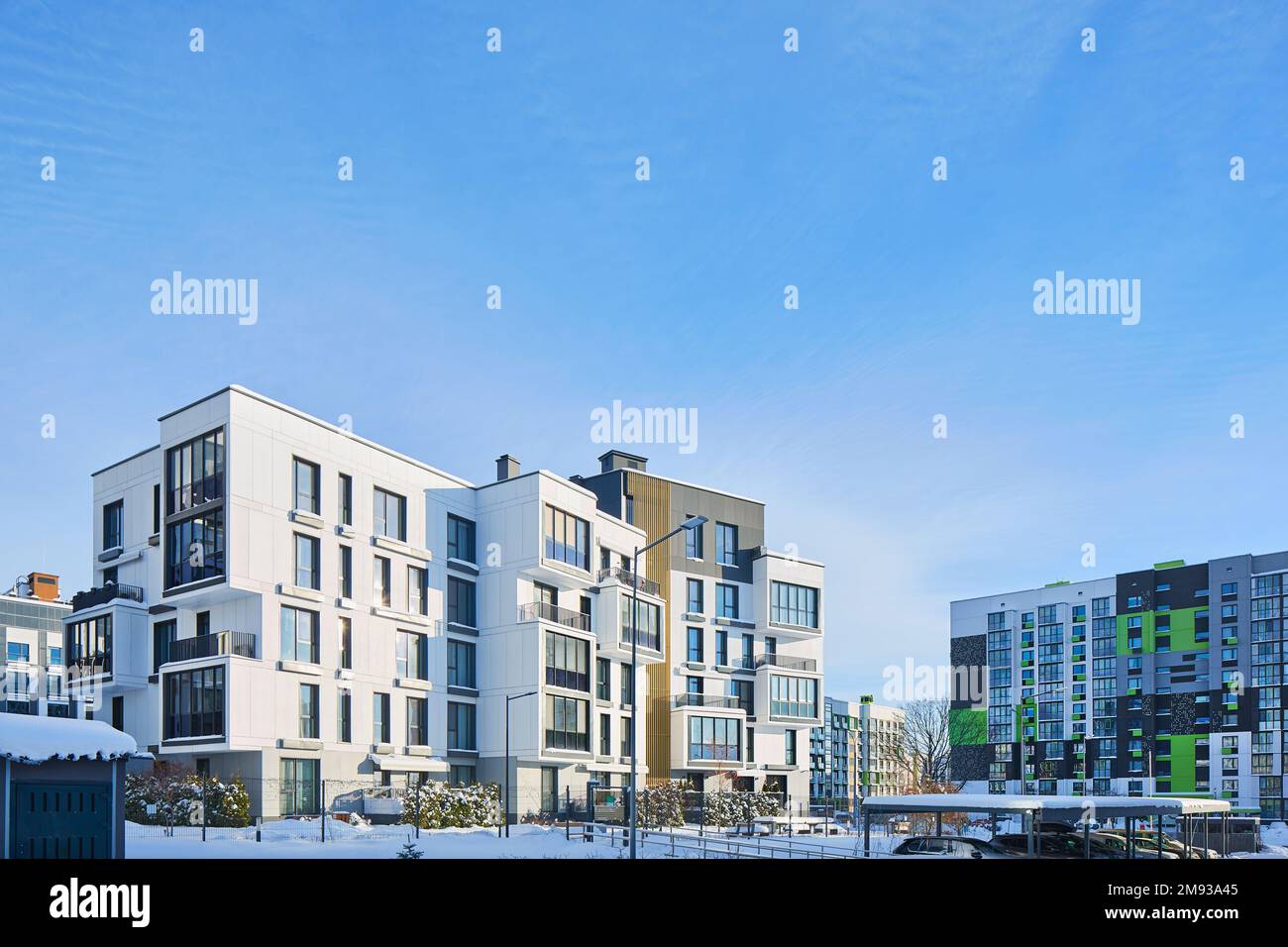 New modern block of flats in green area at winter. residential ...