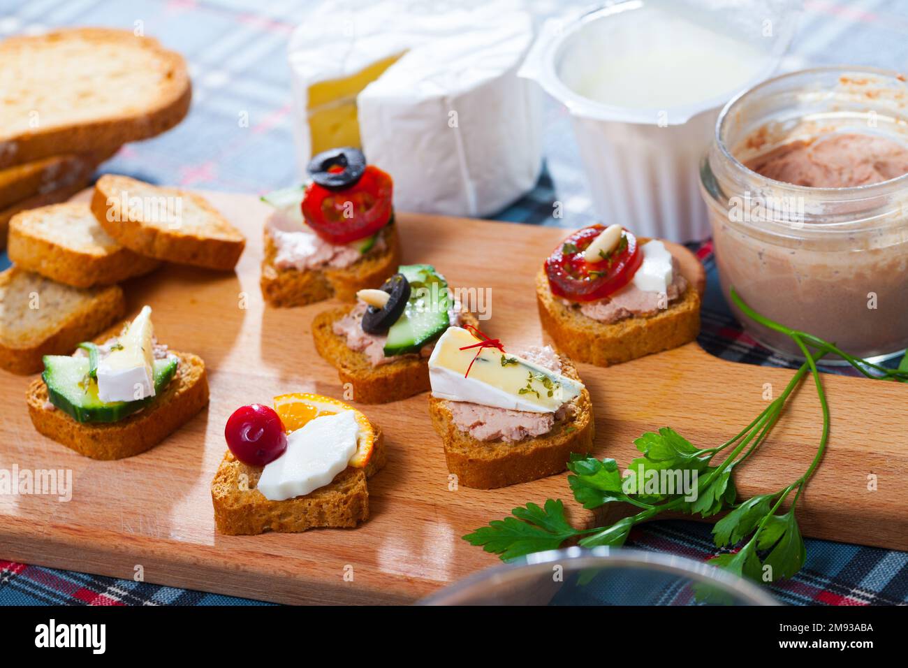 Settee-bed with brie cheese, paste Stock Photo - Alamy