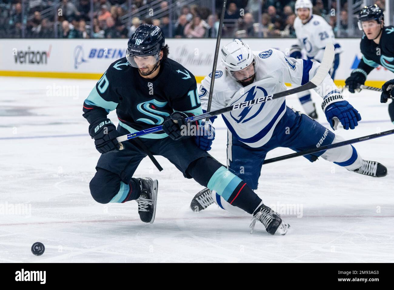 Seattle Kraken forward Matty Beniers, left, skates against Tampa Bay ...