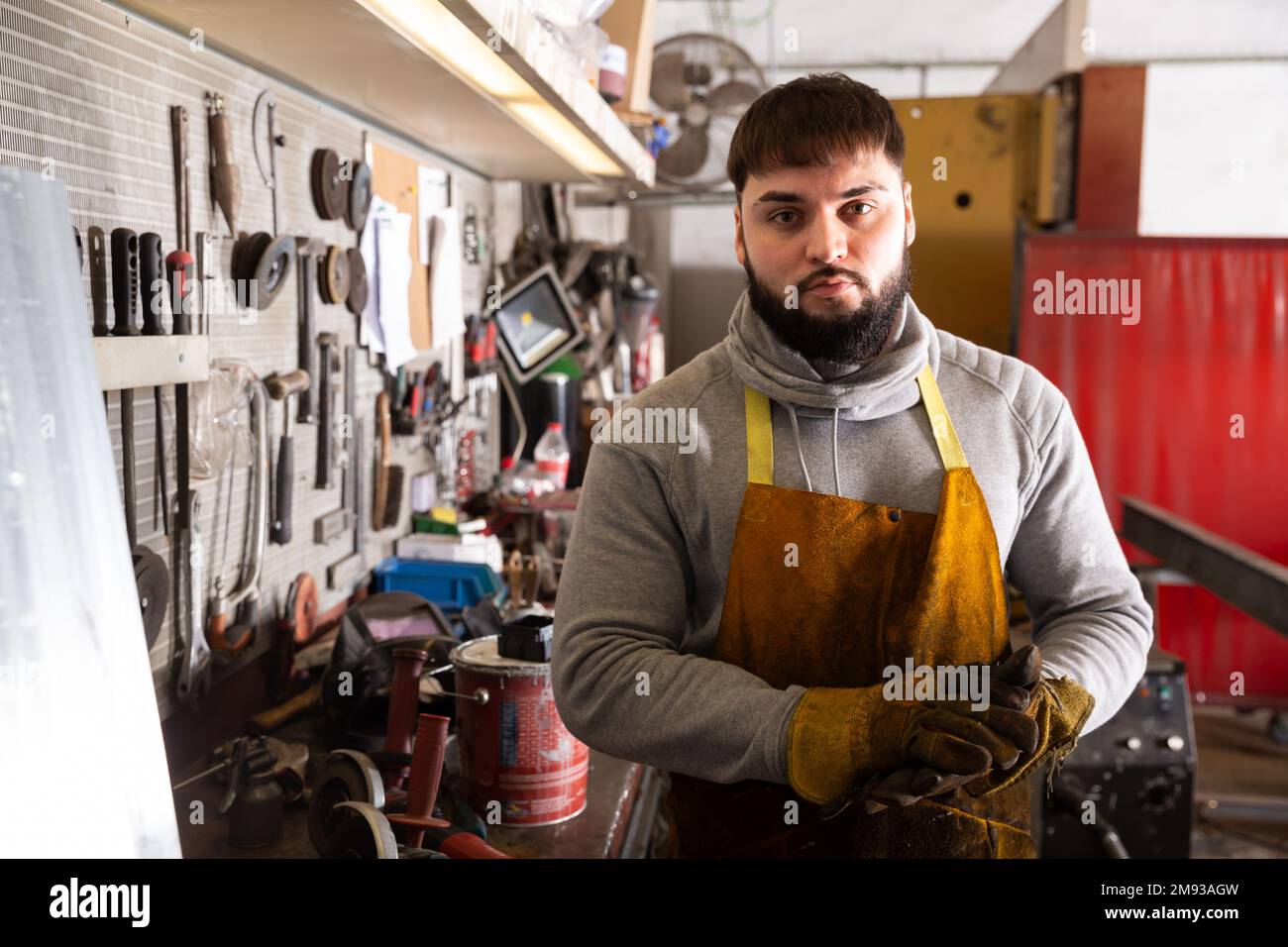 Professional man worker during work with steel in workshop Stock Photo ...