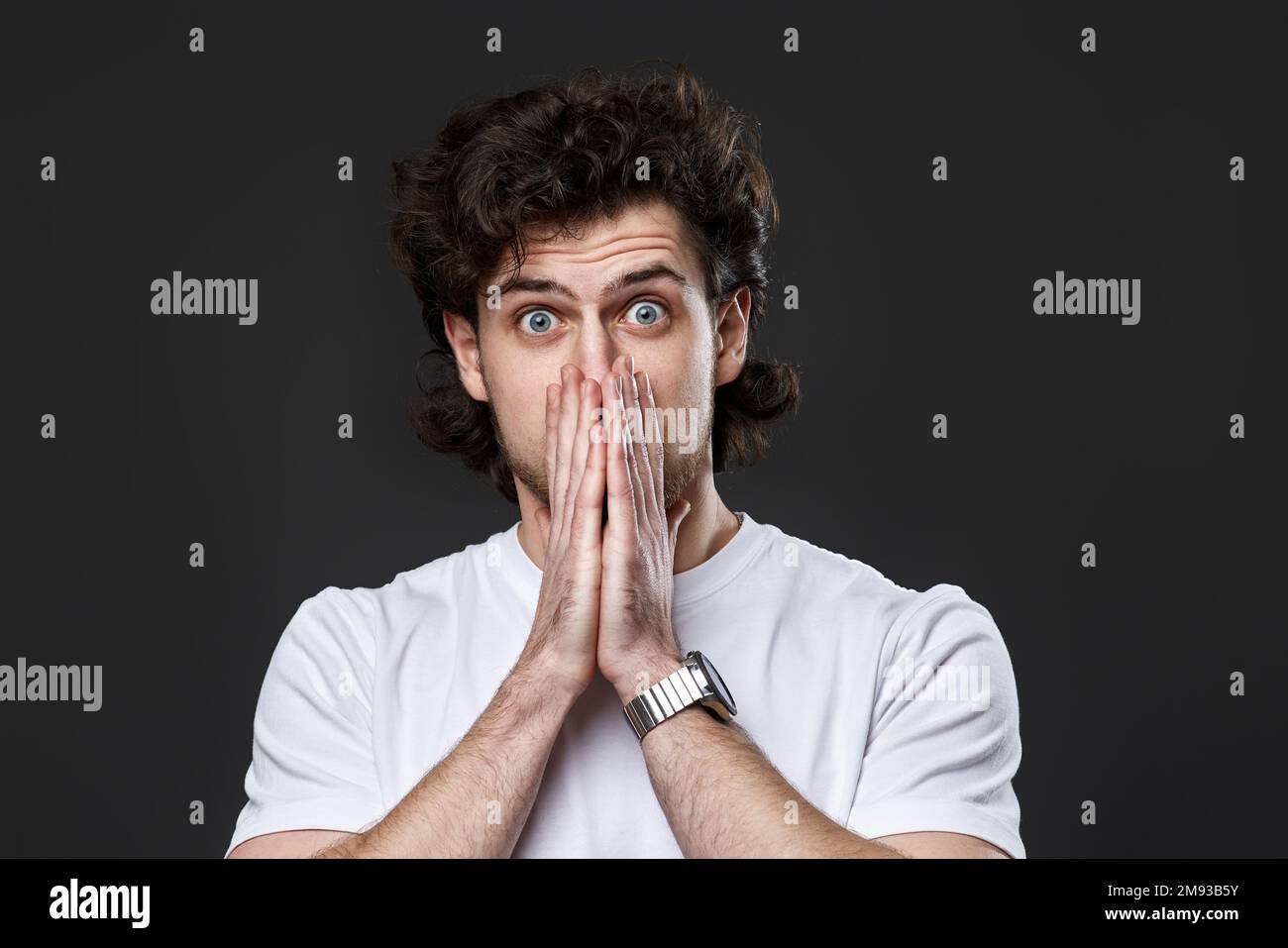 frustrated young man on dark gray background. sadness Stock Photo - Alamy